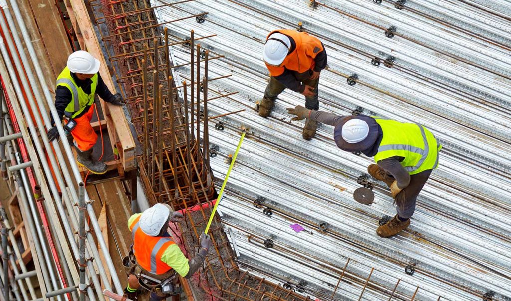 Construction workers building - Desert Fox Logistics - FedEx Partner